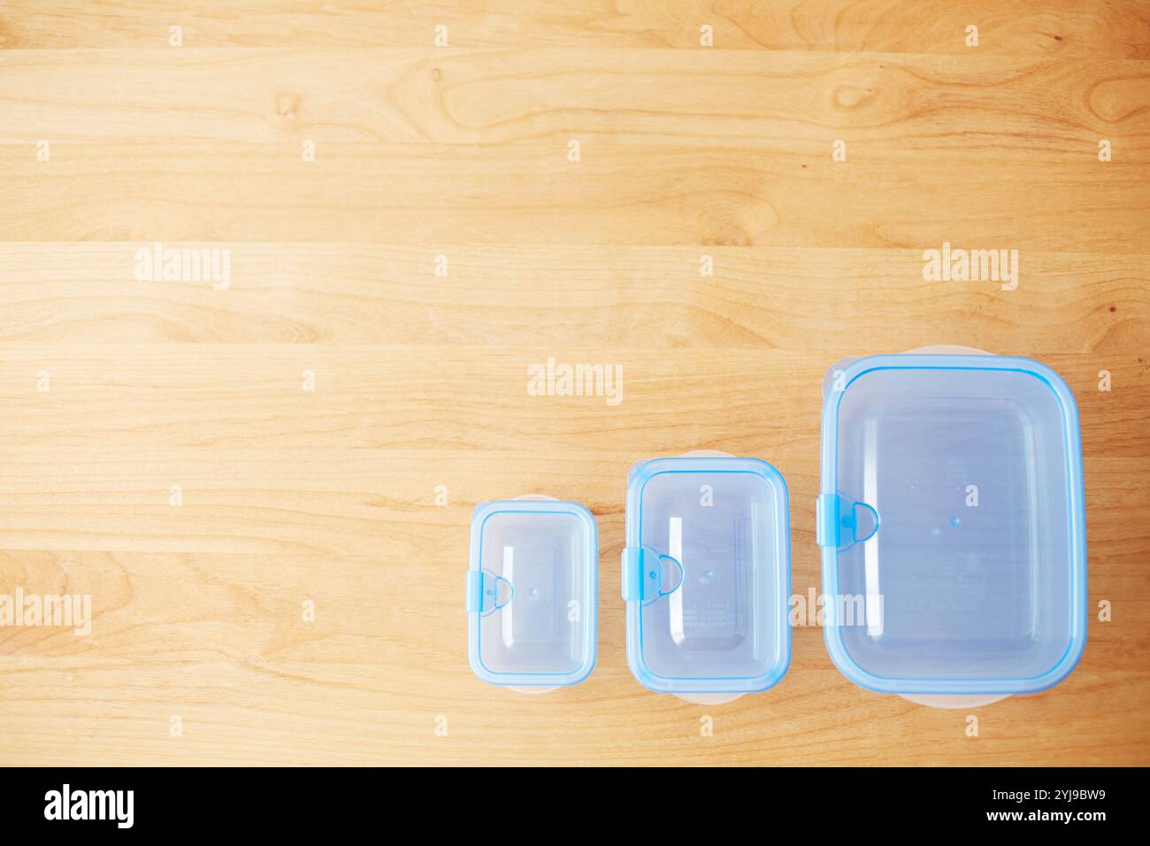 Empty Tupperware on a natural baking sheet Stock Photo - Alamy