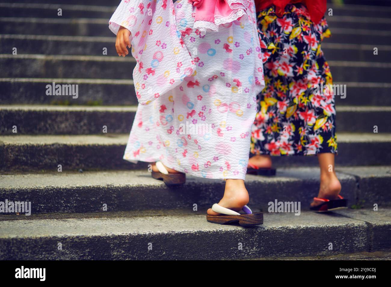 Foot of girl in yukata climbing stairs Stock Photo - Alamy