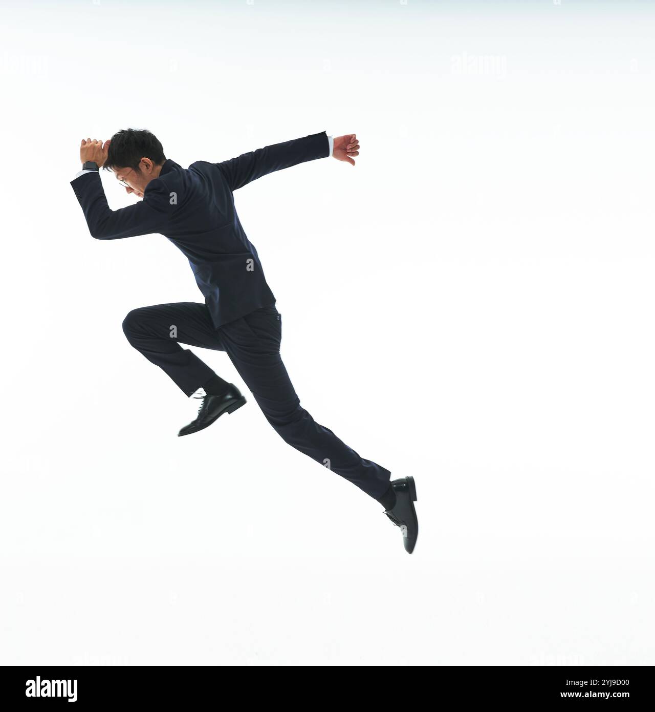 Office worker running with smartwatch Stock Photo - Alamy