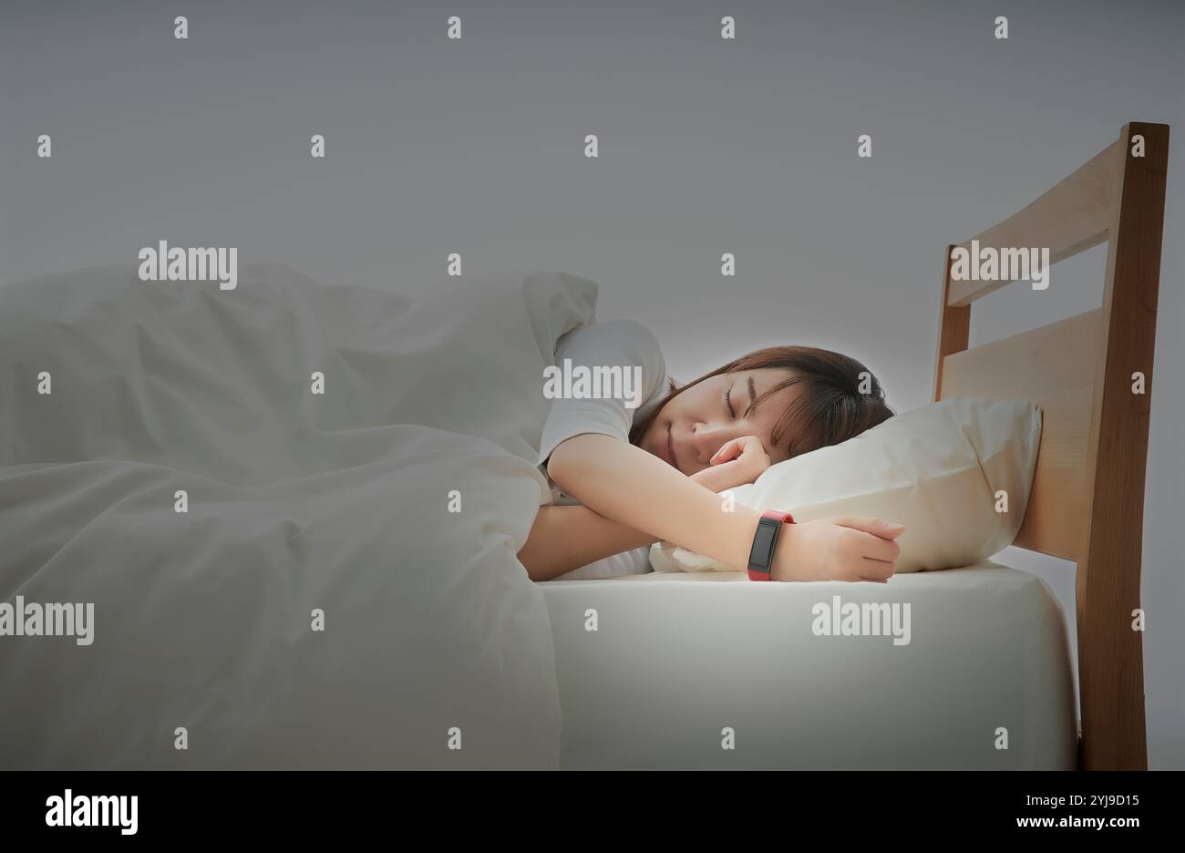 Woman going to bed wearing a smartwatch Stock Photo - Alamy