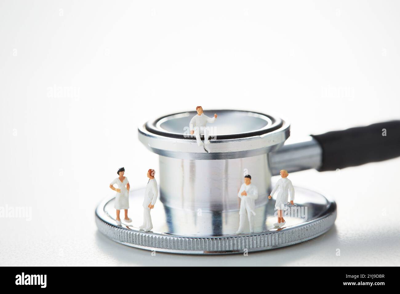 Miniature of nurses and doctors on a stethoscope Stock Photo - Alamy