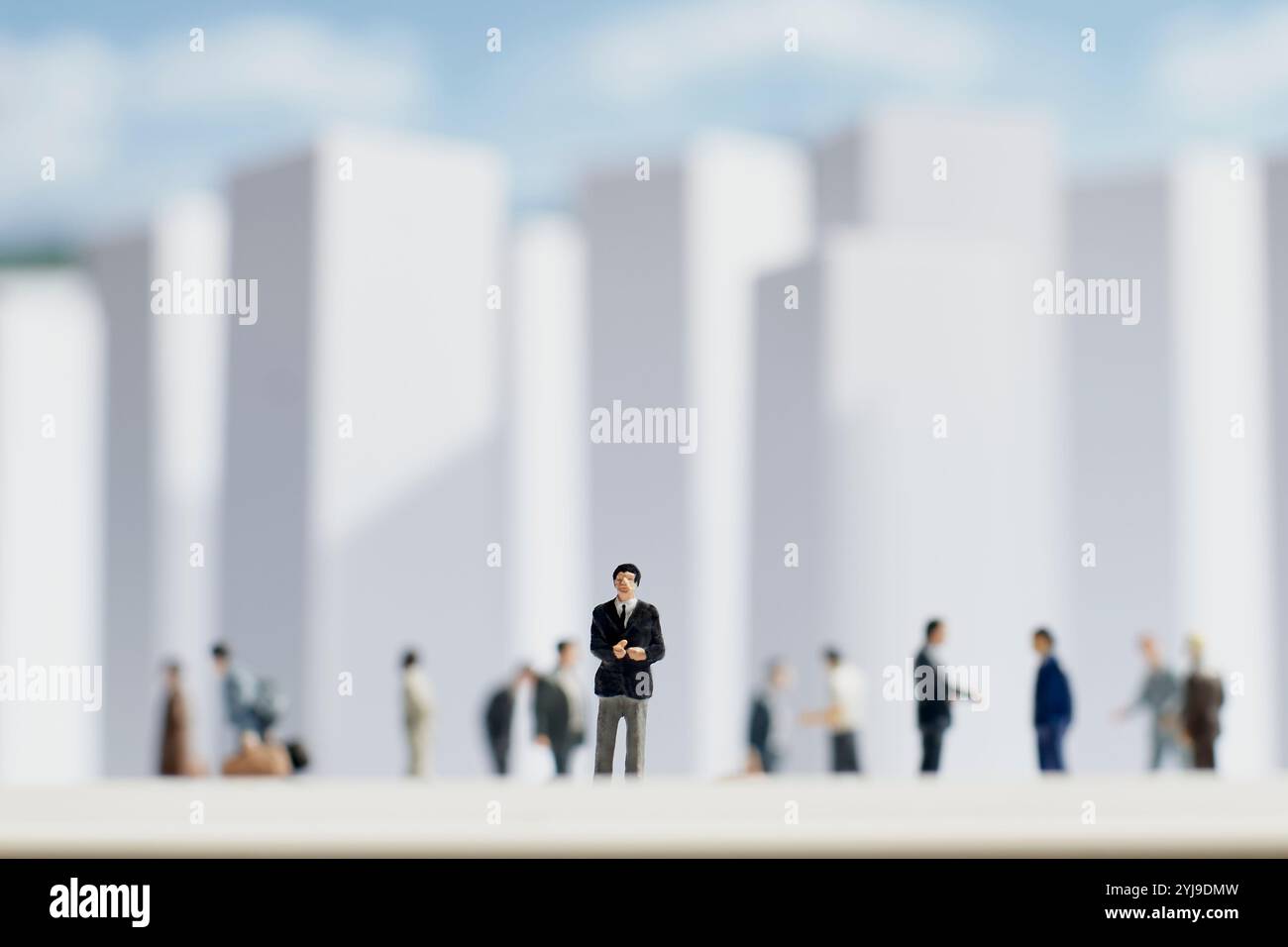 Buildings and miniature office workers Stock Photo - Alamy