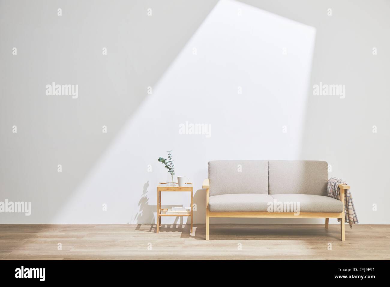 Sofa in simple room Stock Photo - Alamy