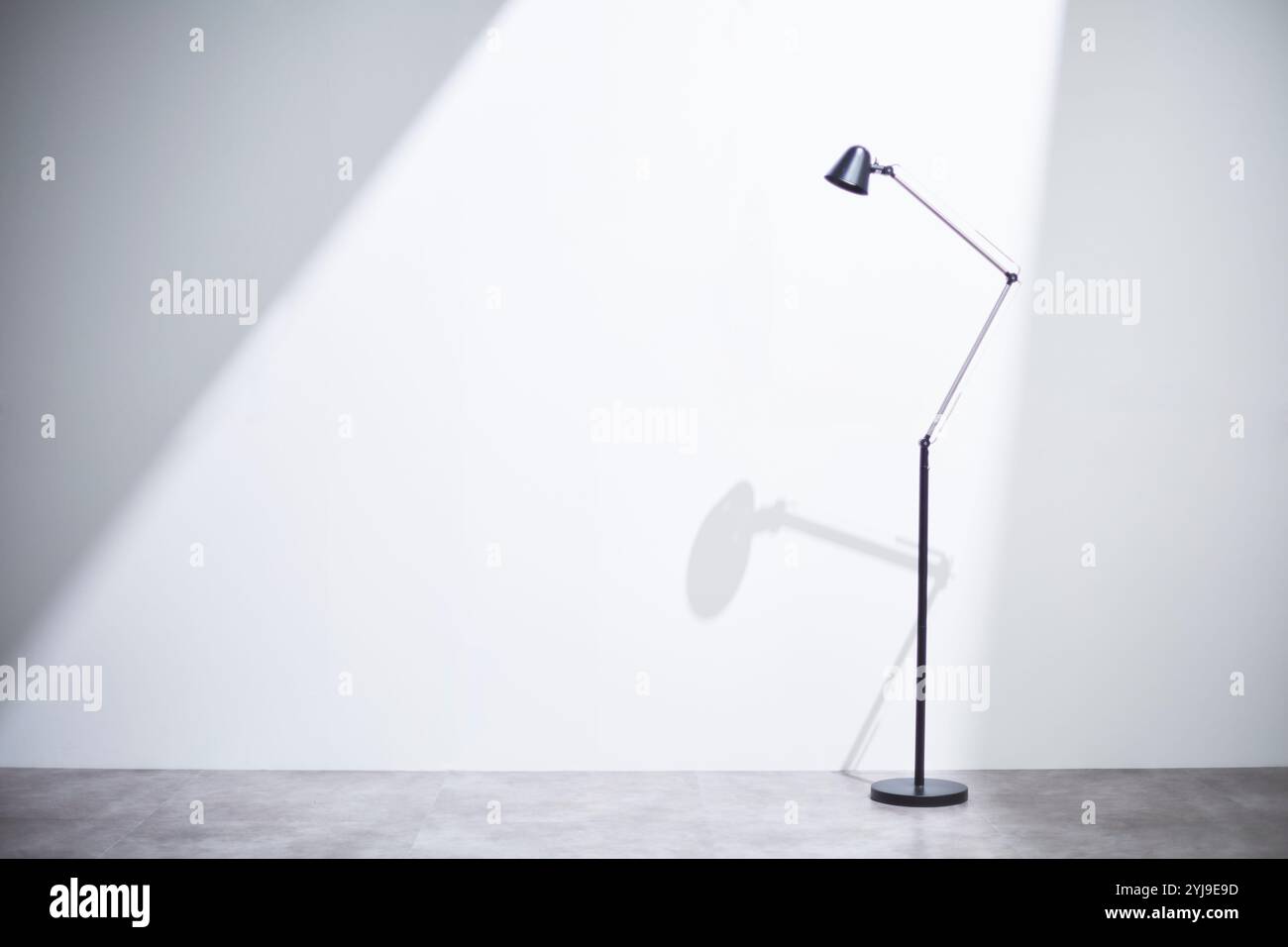 Simple room with sunlight shining through a skylight Stock Photo - Alamy