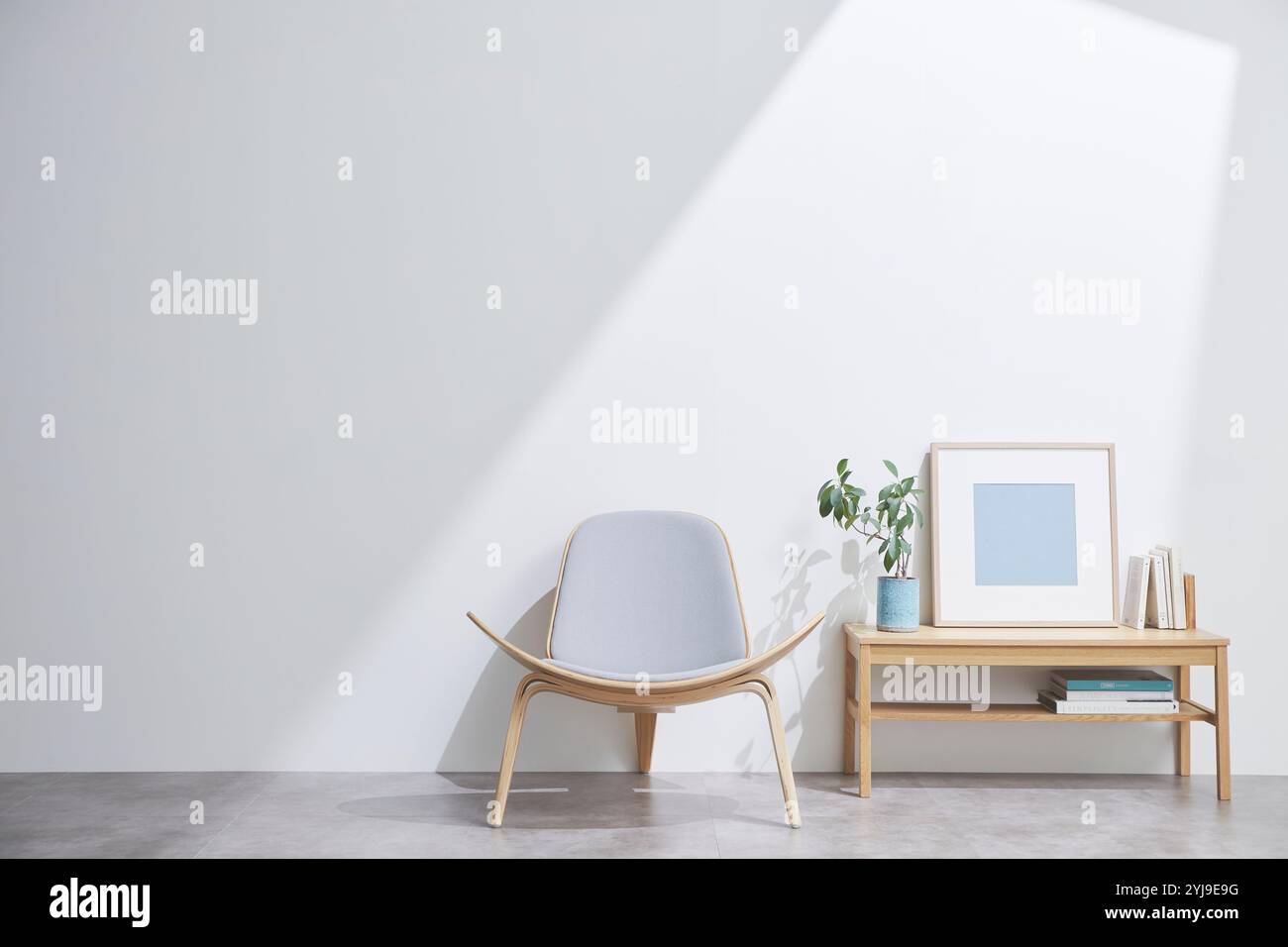 Chair and shelf in a simple room Stock Photo - Alamy
