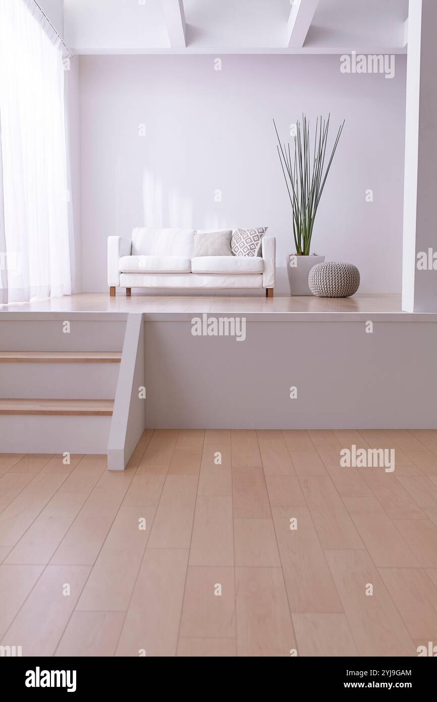 Large, simple room on step floor Stock Photo - Alamy