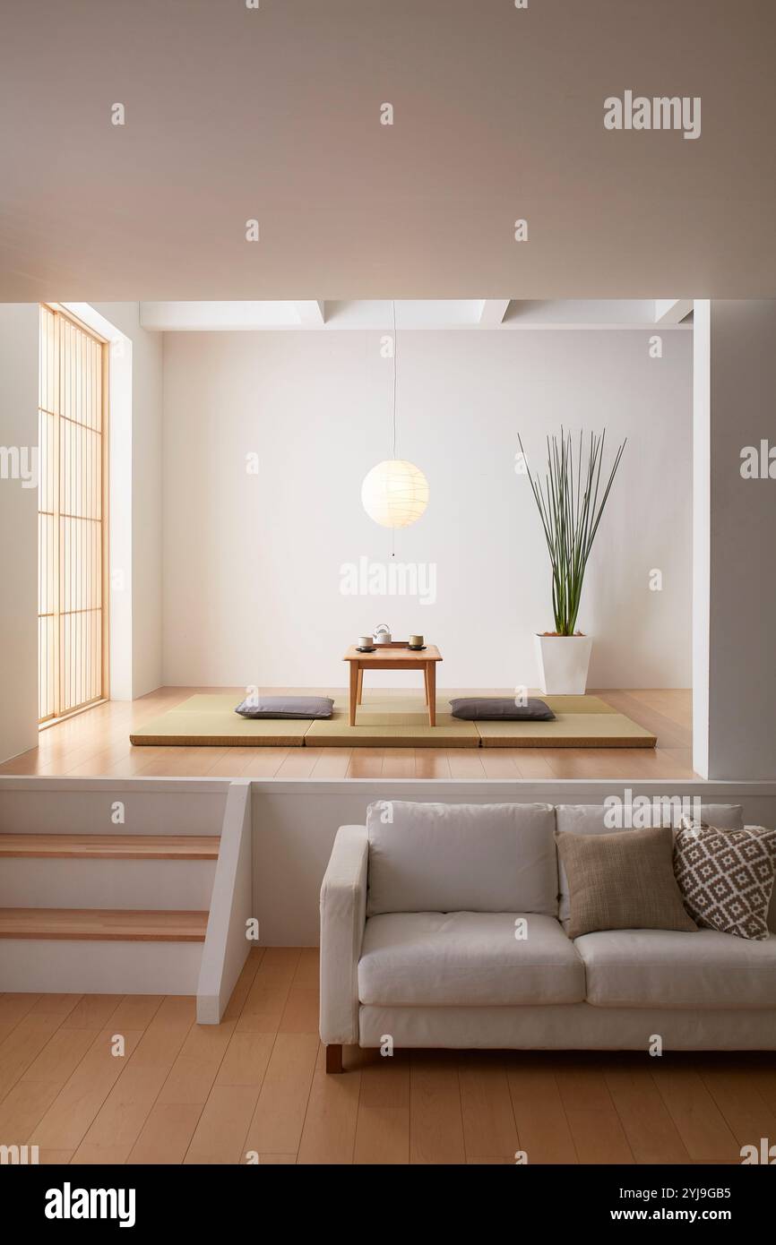 Simple living room with step floor Stock Photo - Alamy