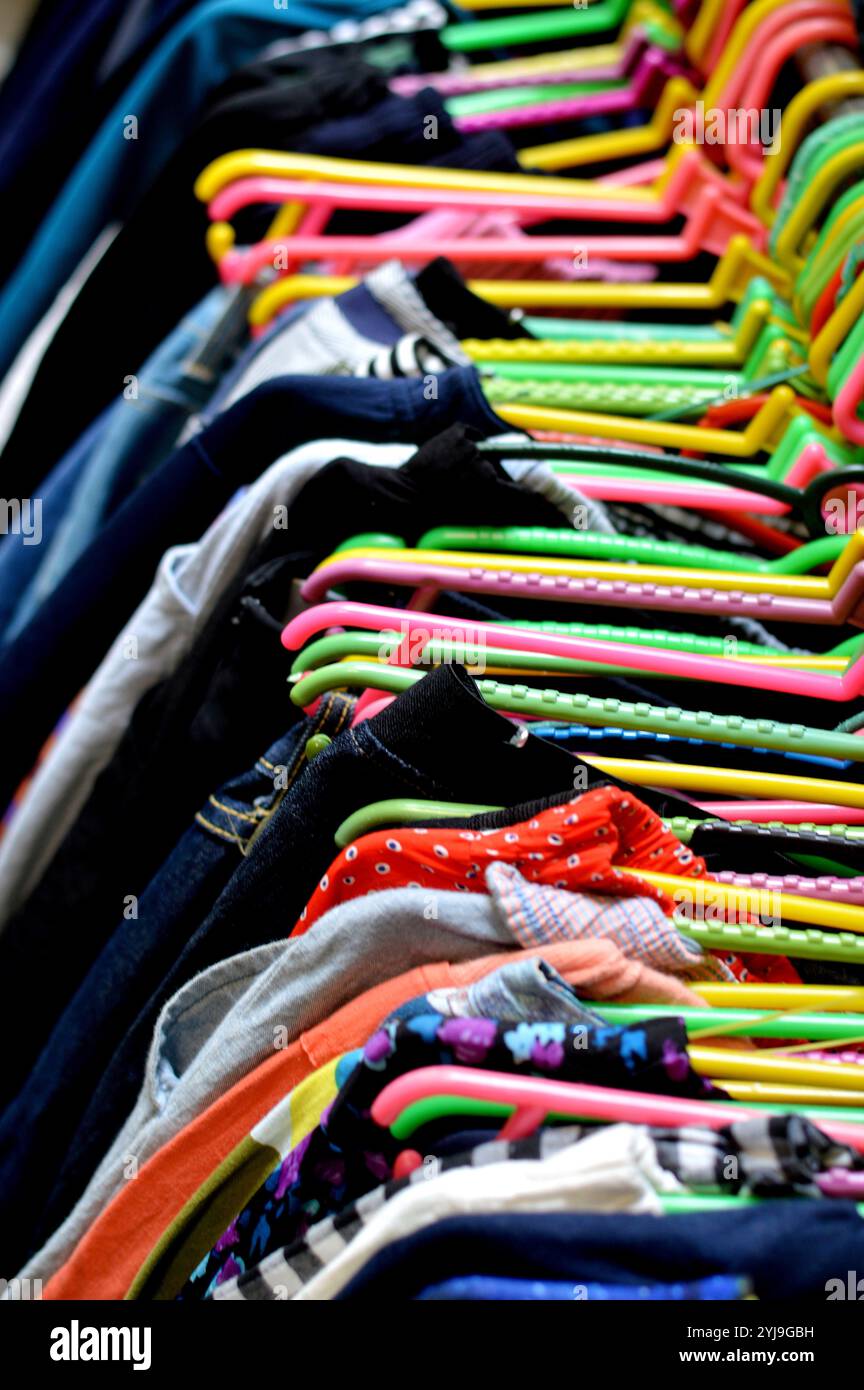 used clothing display in the market Stock Photo - Alamy