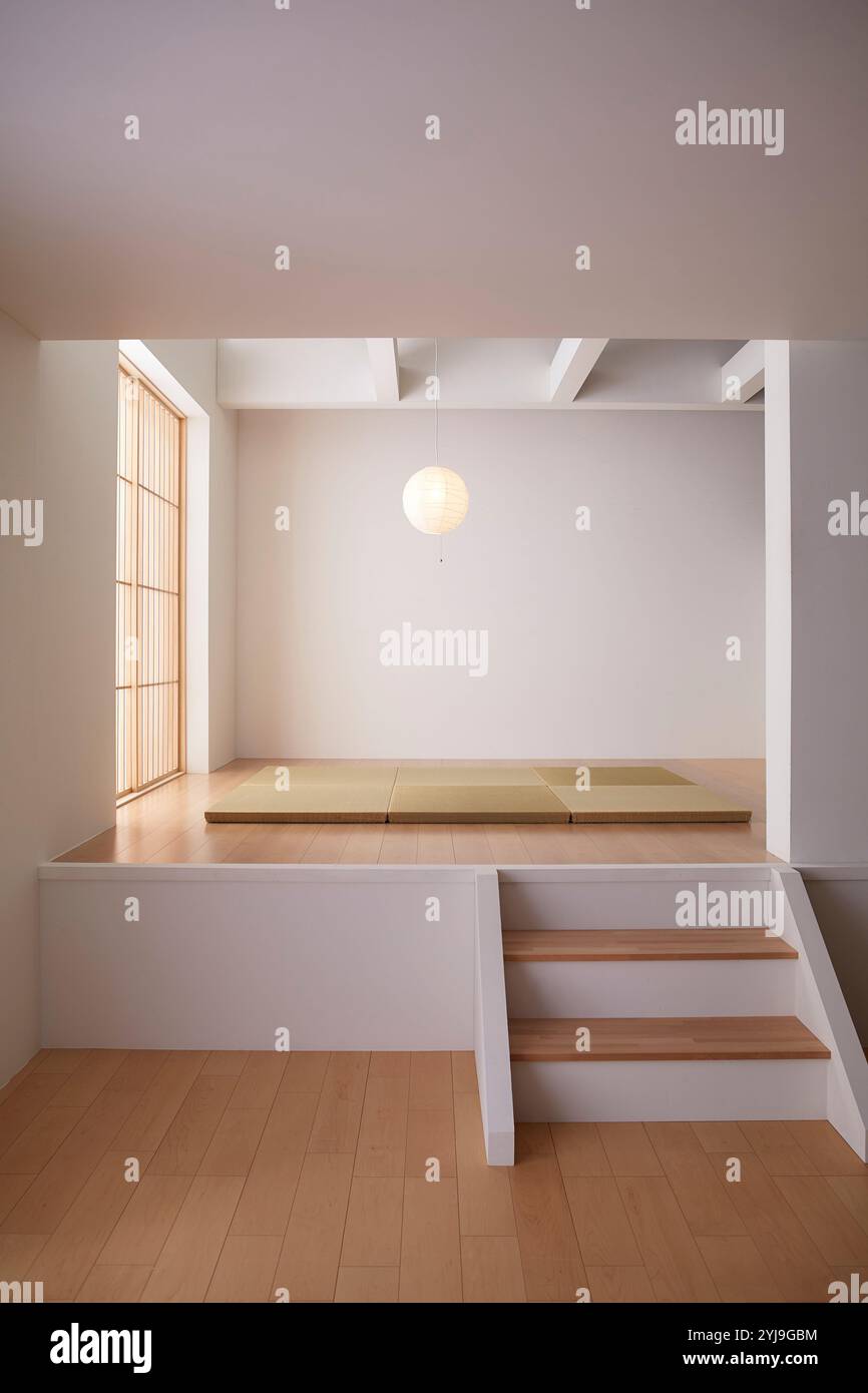 Simple living room with step floor Stock Photo - Alamy