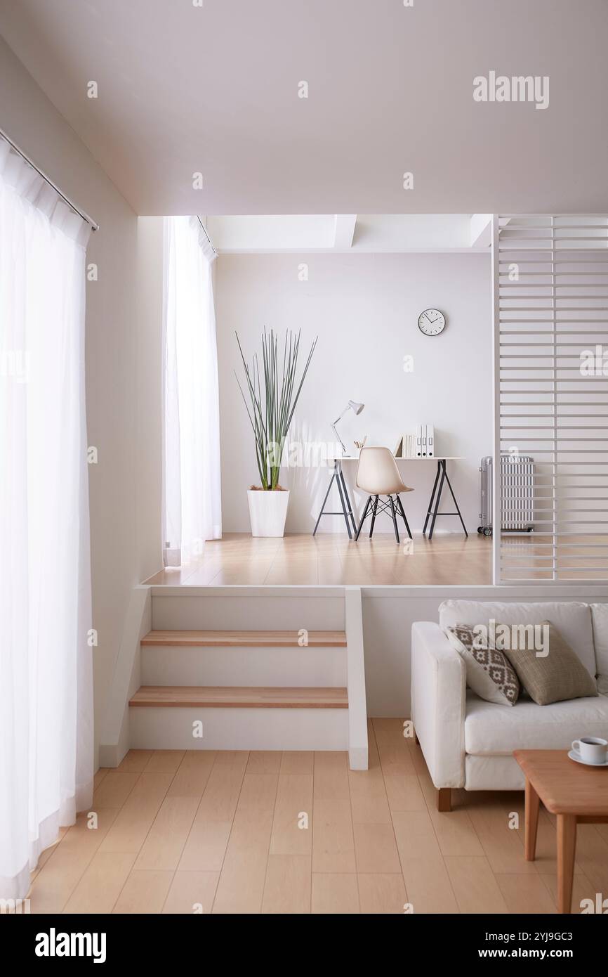 Simple living room with step floor Stock Photo - Alamy