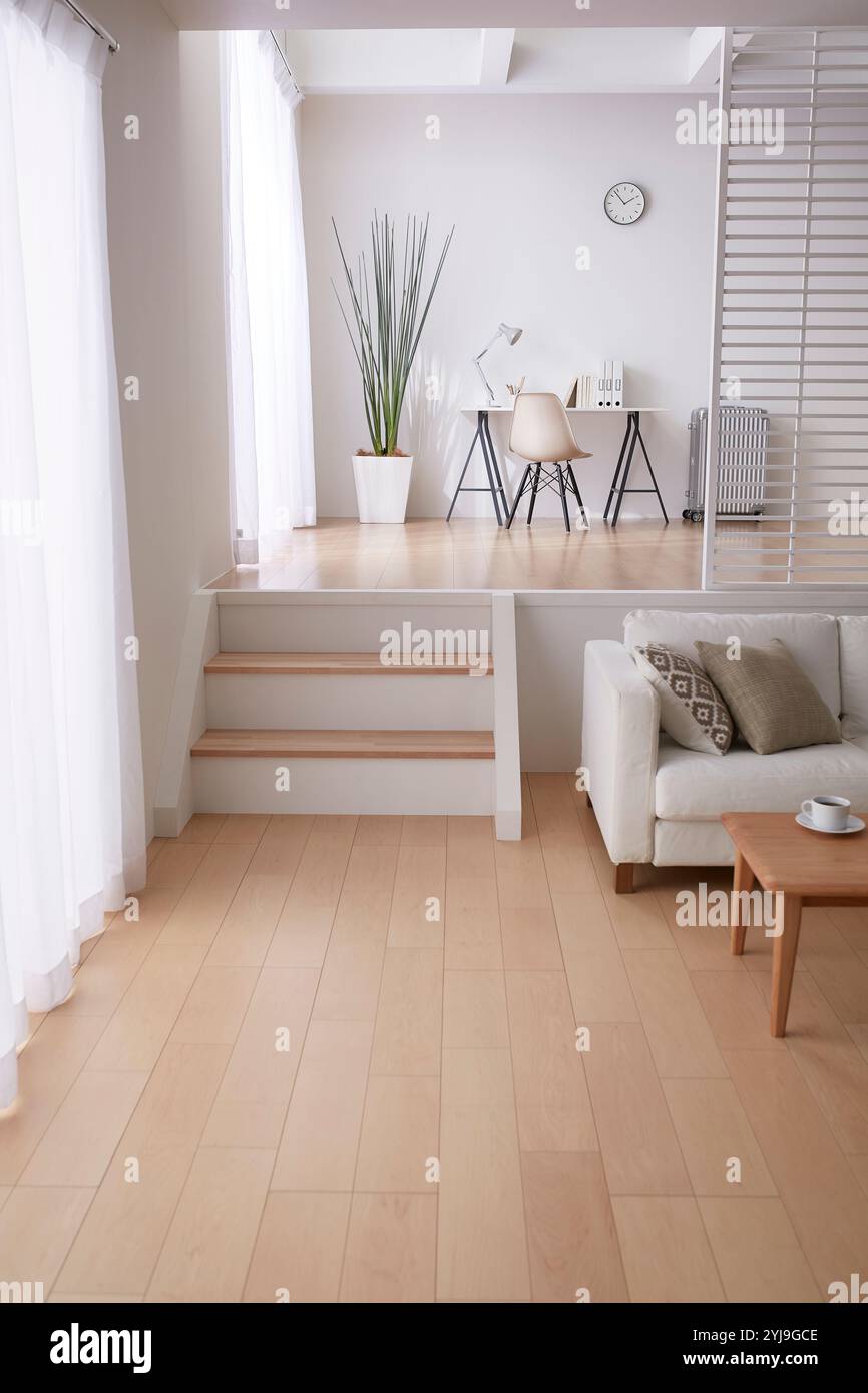 Simple living room with step floor Stock Photo - Alamy