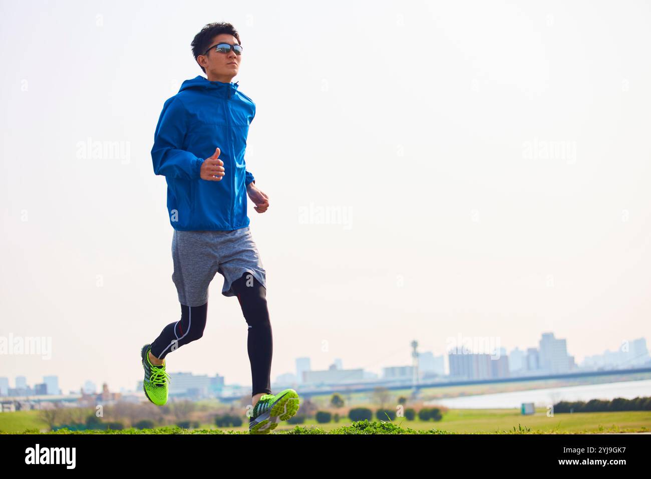 Sportsman running on riverbed Stock Photo - Alamy