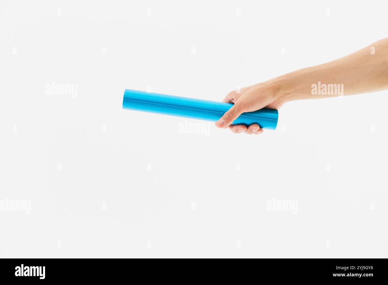 Male athletes passing baton in the hands of male athletes Stock Photo ...