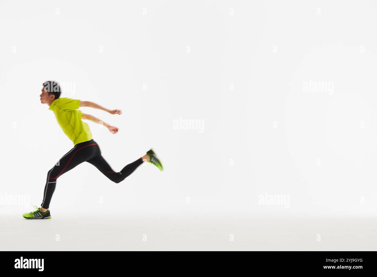 Male track and field athlete stretching his chest just before the ...