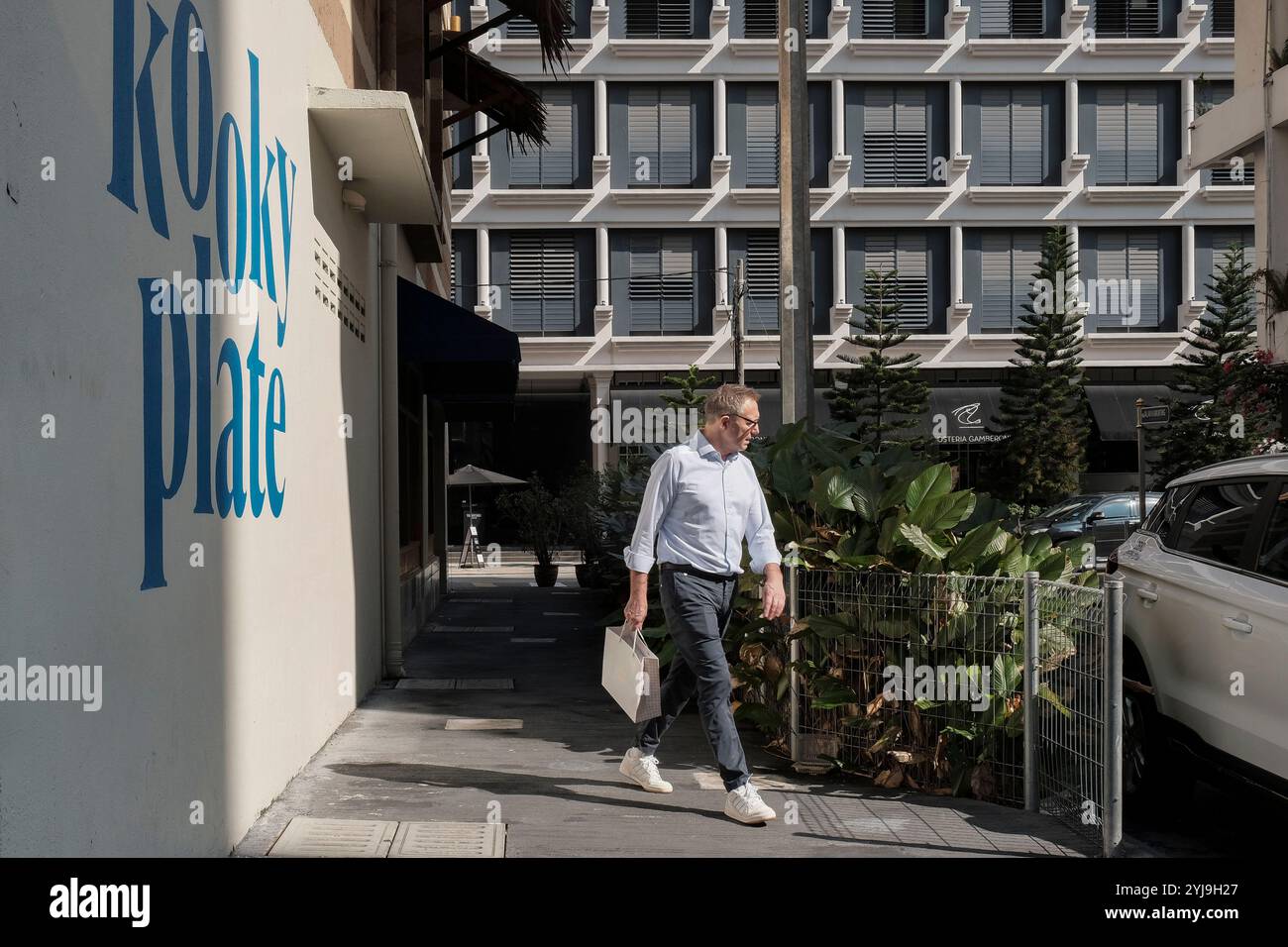 A foreigner man seen walks in a casual outfits at Kuala Lumpur. Daily ...