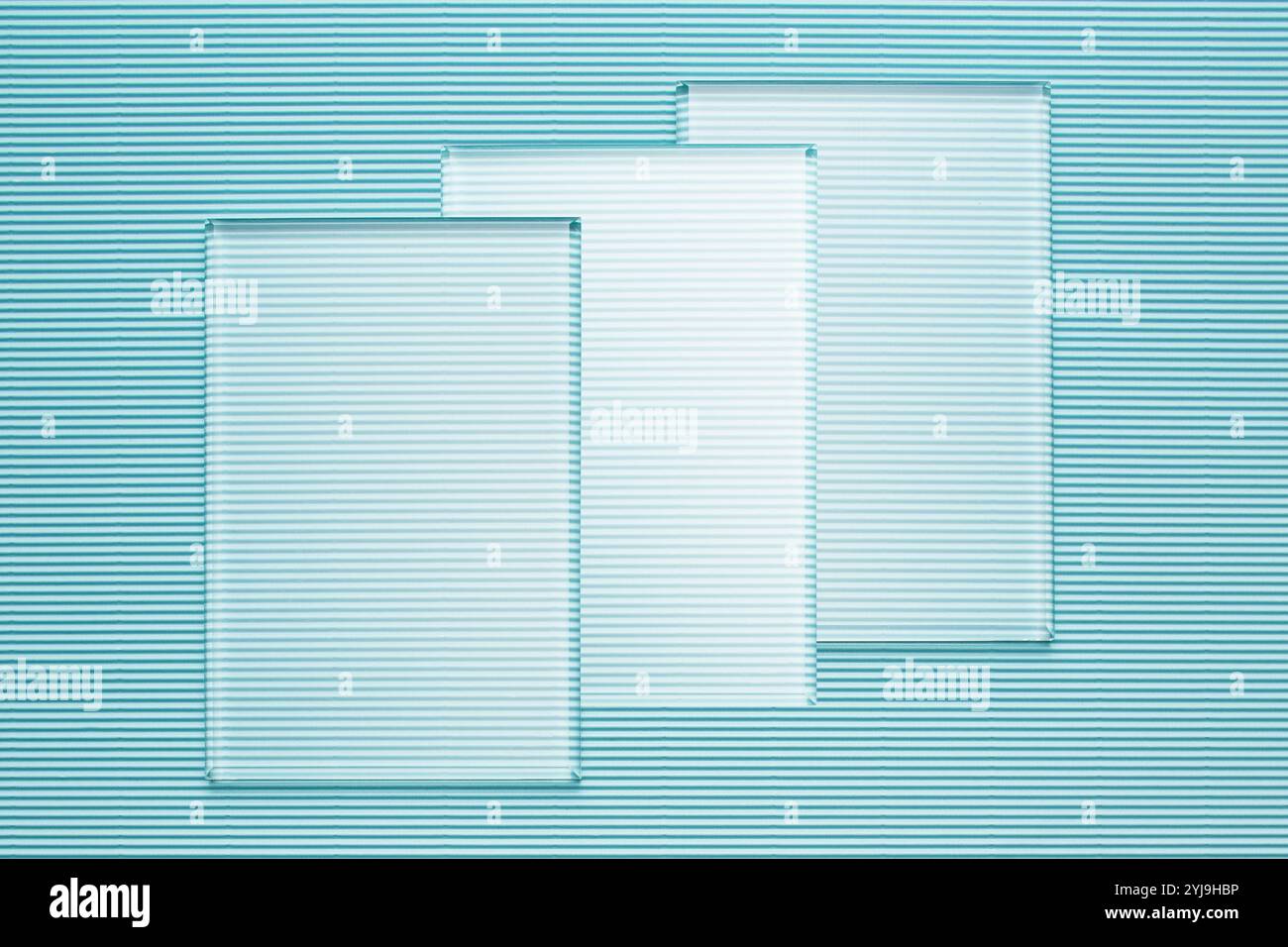 Overlapping square glass plates on corrugated cardboard Stock Photo - Alamy