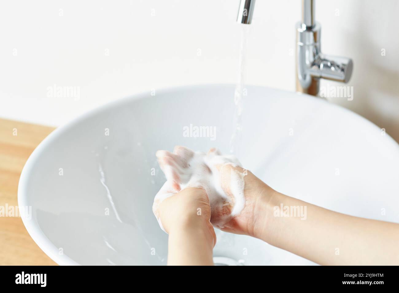 Woman washing hands stylish basin hi-res stock photography and images ...