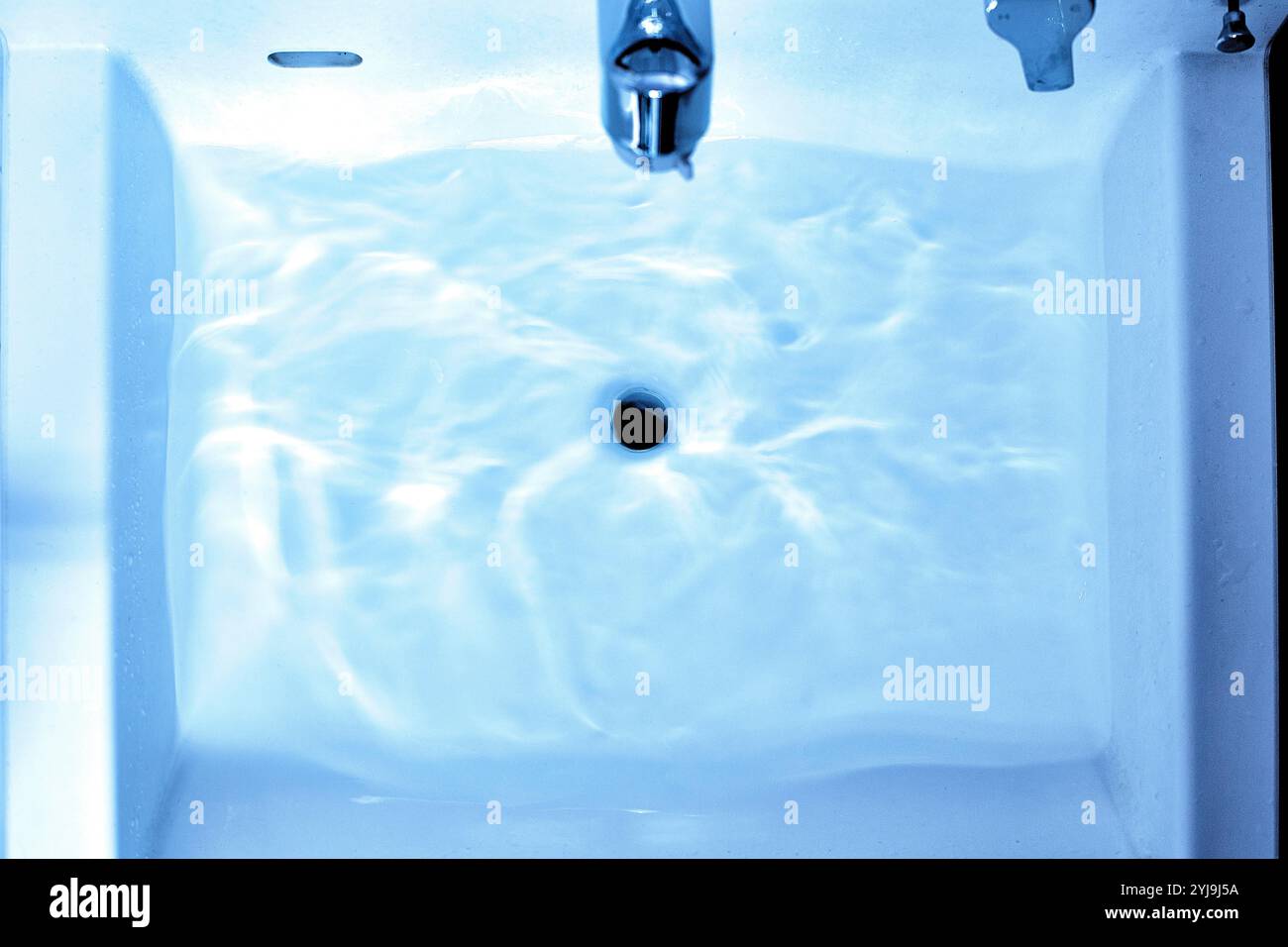 Shaking water in washbasin Stock Photo - Alamy