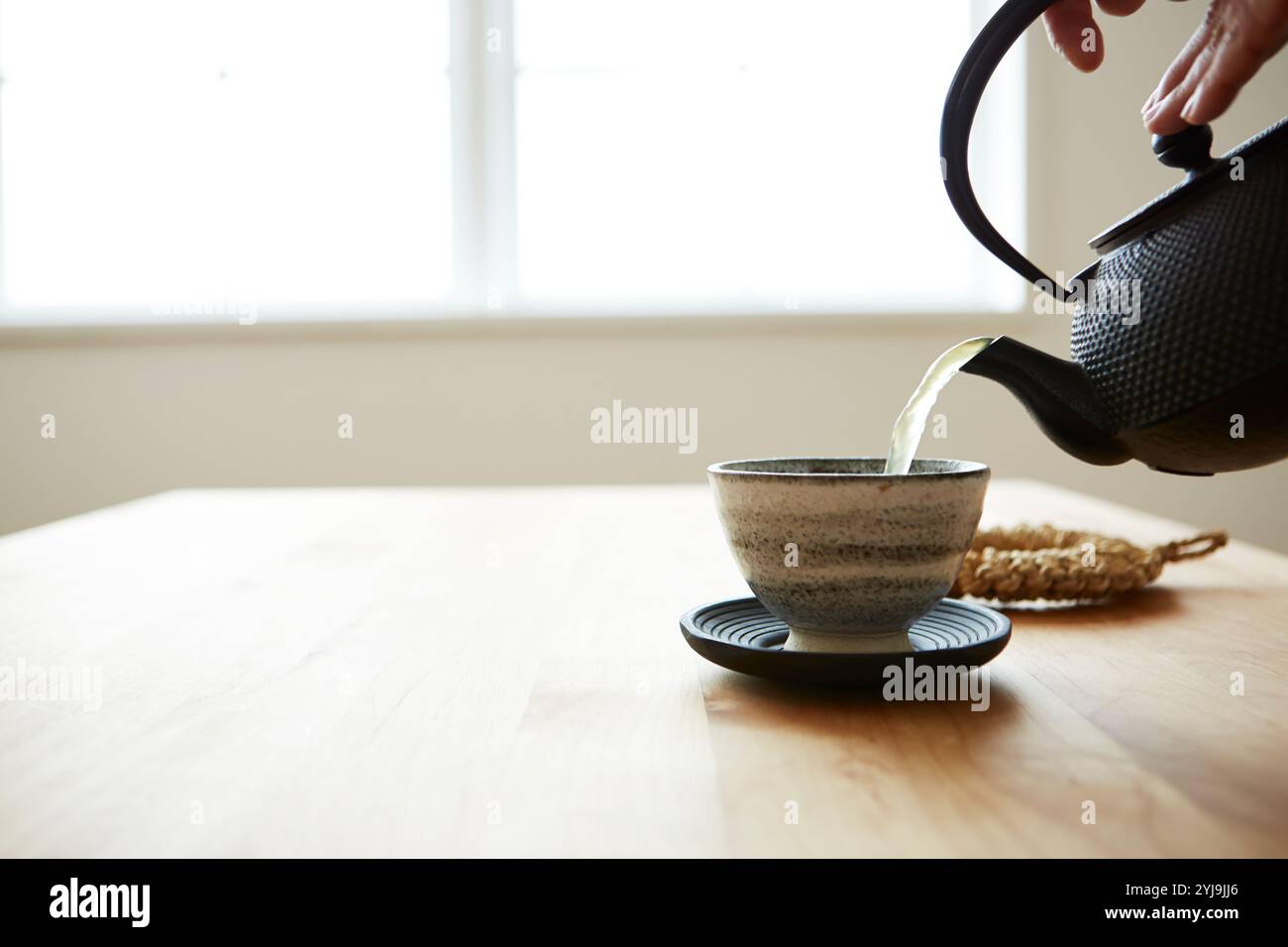 Woman pouring green tea hi-res stock photography and images - Alamy