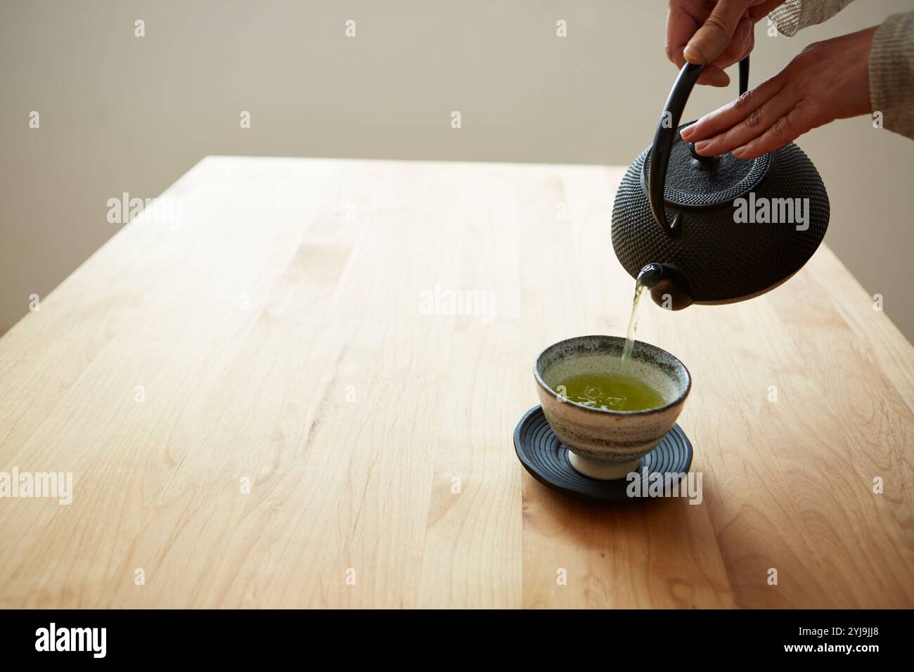 Woman pouring green tea hi-res stock photography and images - Alamy