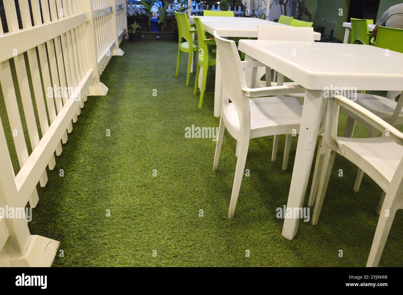 plastic table set on the fake grass Stock Photo - Alamy