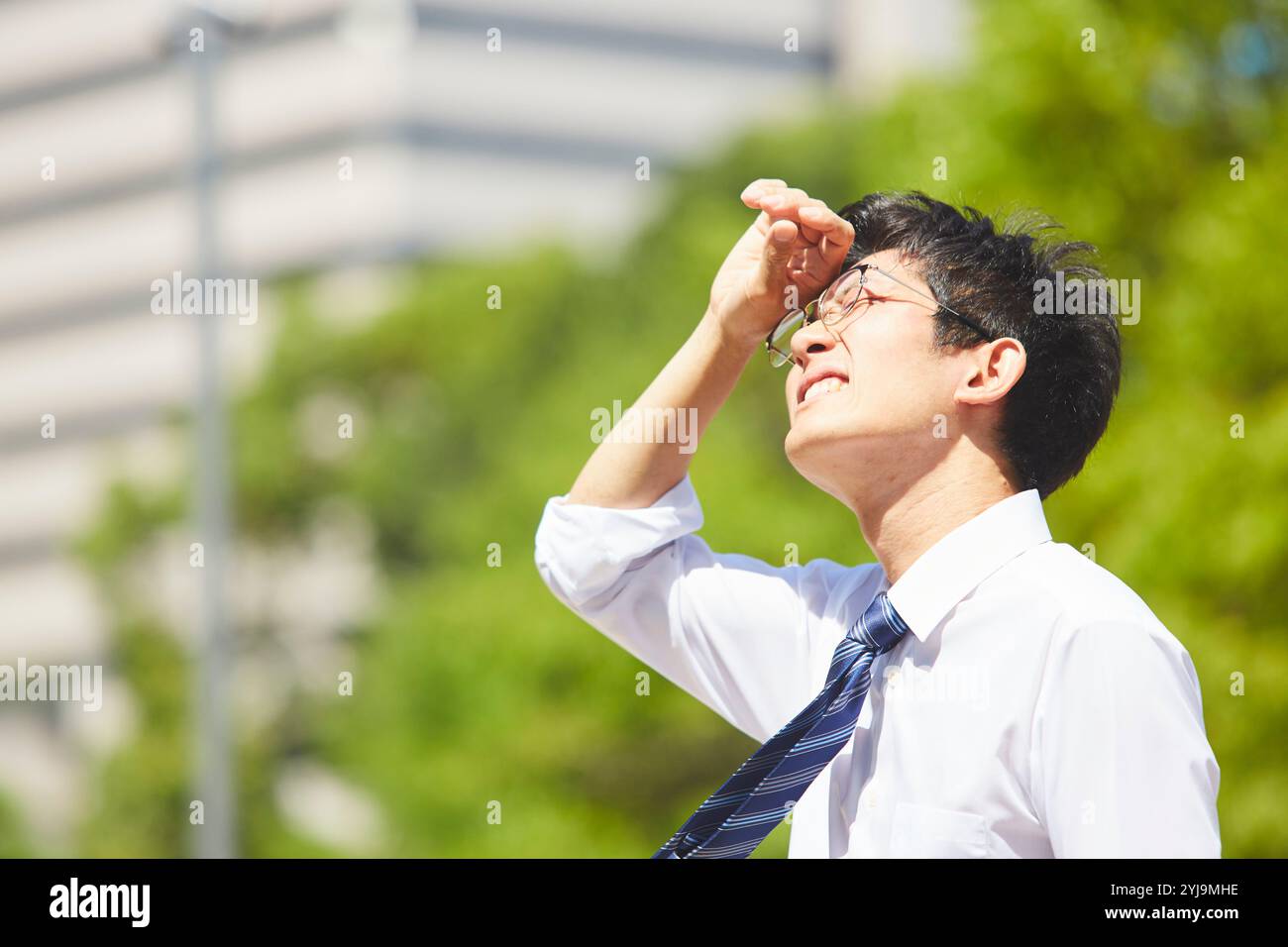 Office worker suffering from heat stroke under the blazing sun Stock ...