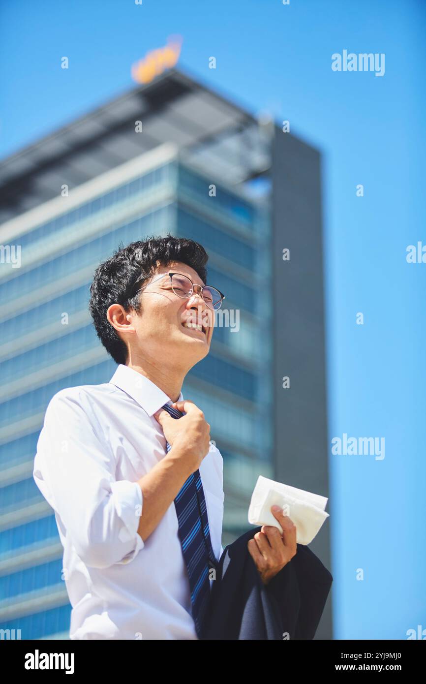 Office worker with heat stroke under the blazing sun Stock Photo - Alamy