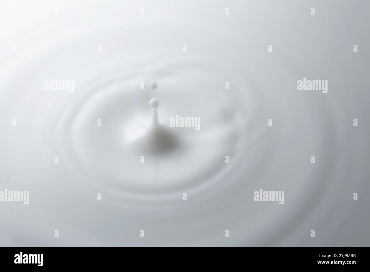 Ripples of white liquid Stock Photo - Alamy