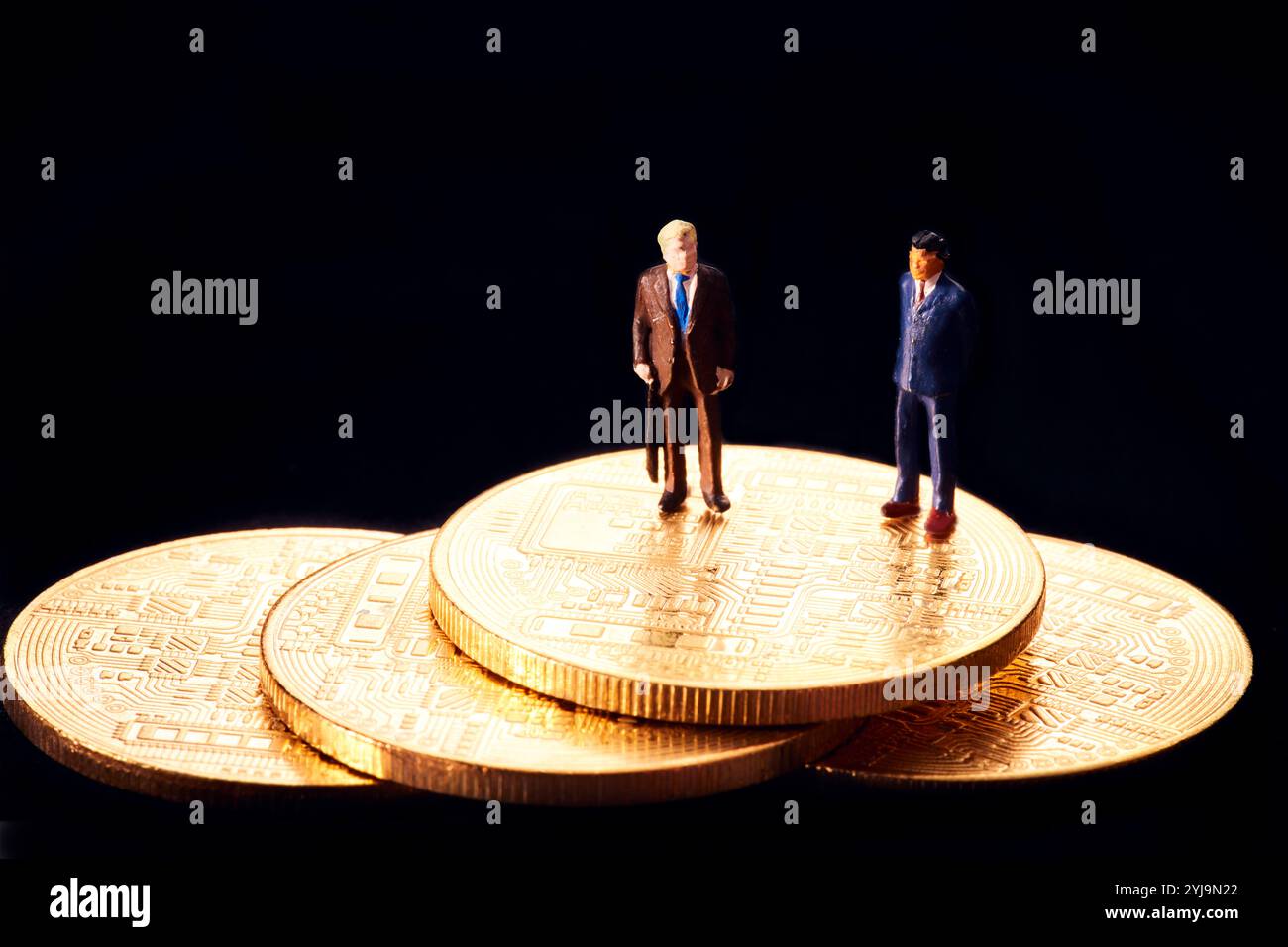 Miniature doll of man in suit on coin Stock Photo - Alamy