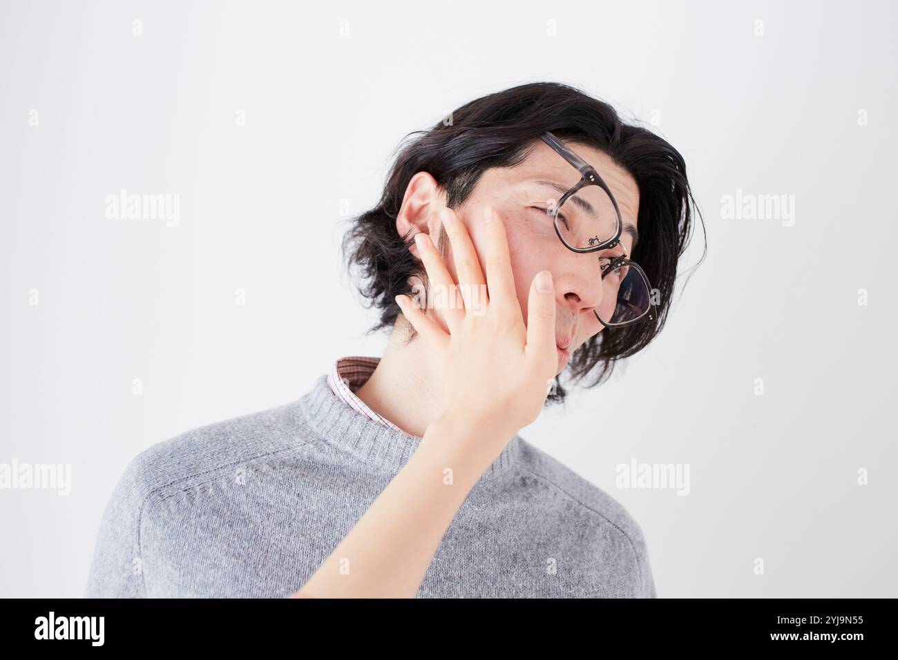 Woman's hand slapping man with glasses Stock Photo - Alamy