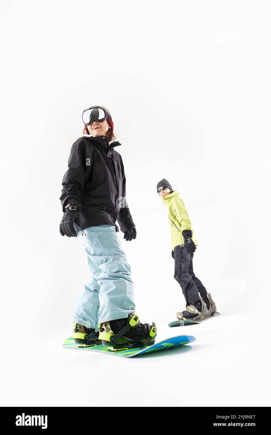 Couple snowboarding Cut Out Stock Images & Pictures - Alamy