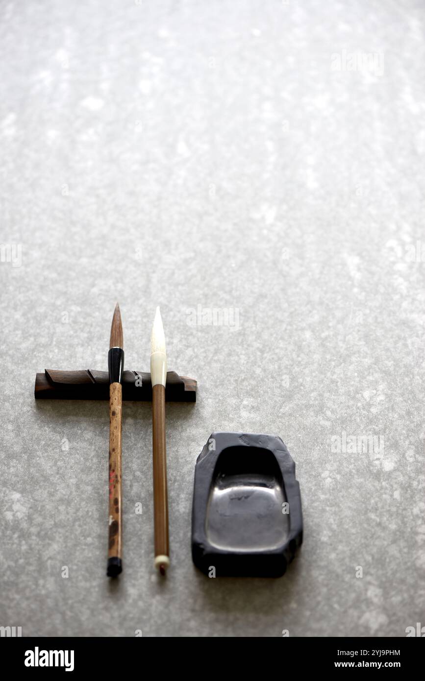 Calligraphy tools on stone slab Stock Photo - Alamy