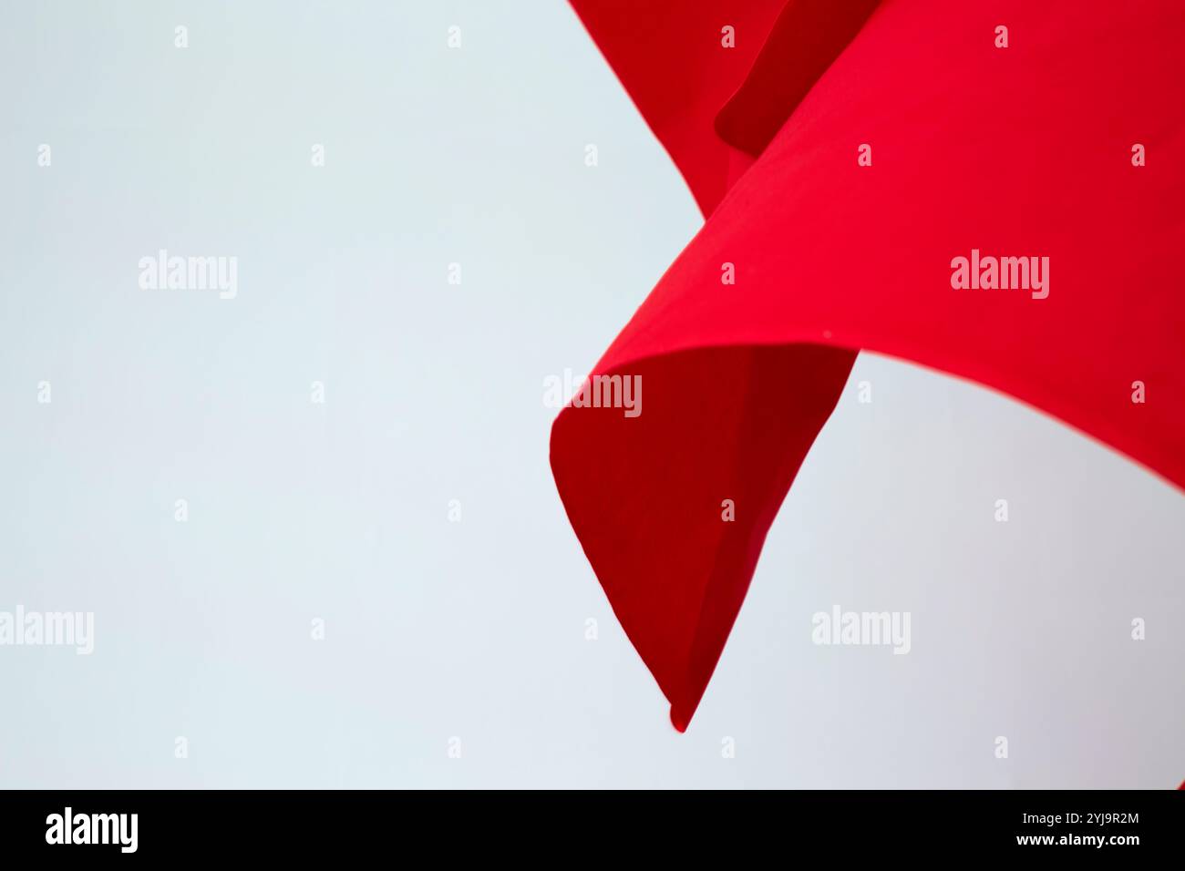 Red flag waving in the air Stock Photo - Alamy