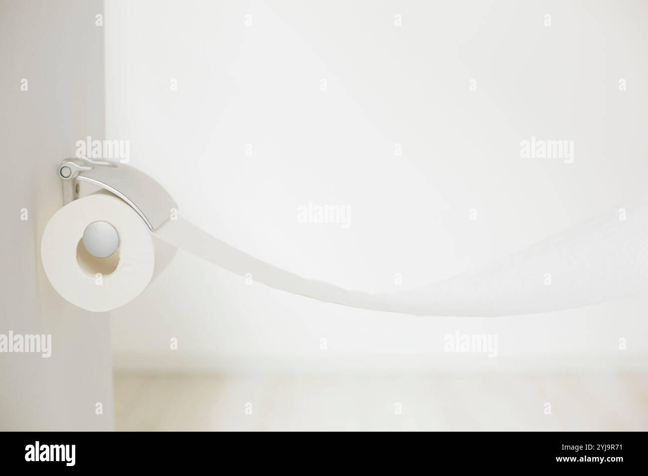 Toilet paper fluttering in white space Stock Photo - Alamy
