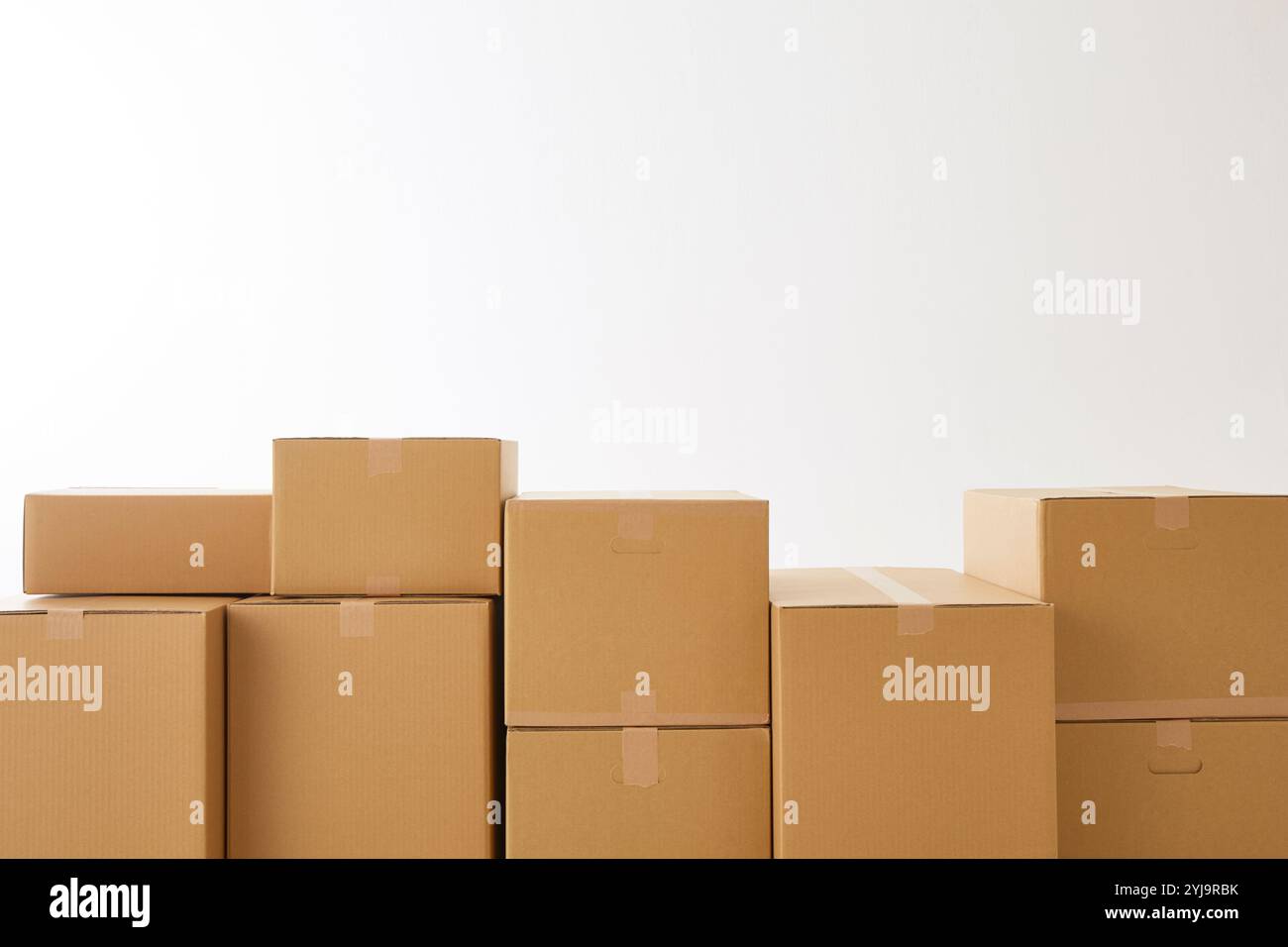 Arranged cardboard boxes Stock Photo - Alamy