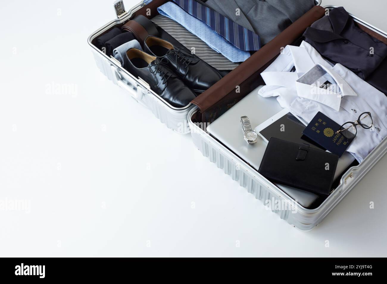 Packing for an overseas business trip Stock Photo - Alamy