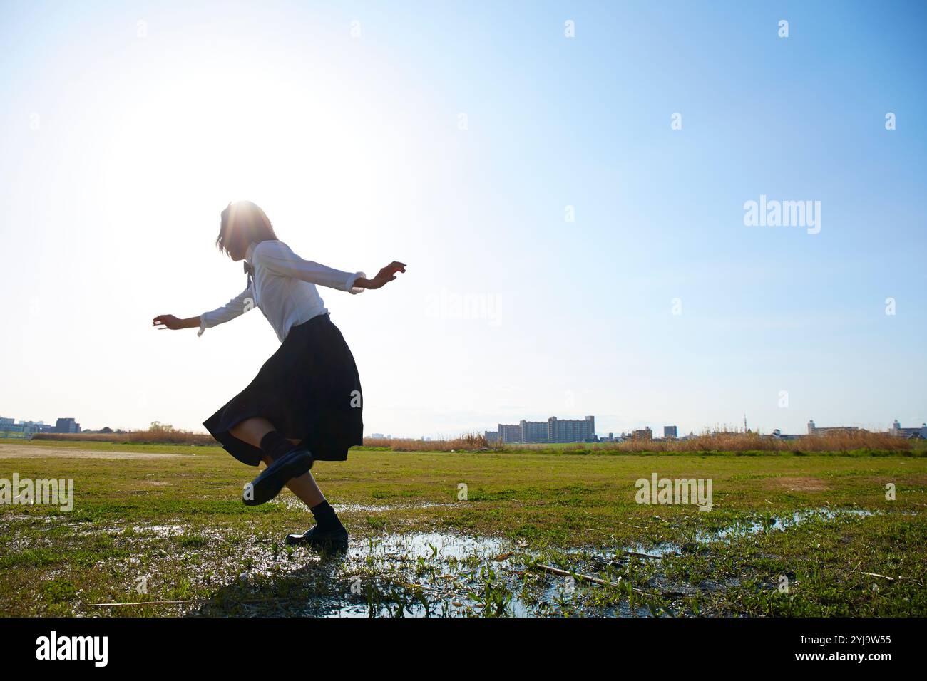 High school girl running on ground Stock Photo - Alamy