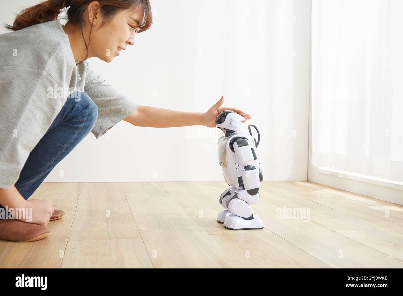 Woman stroking wall hi-res stock photography and images - Alamy