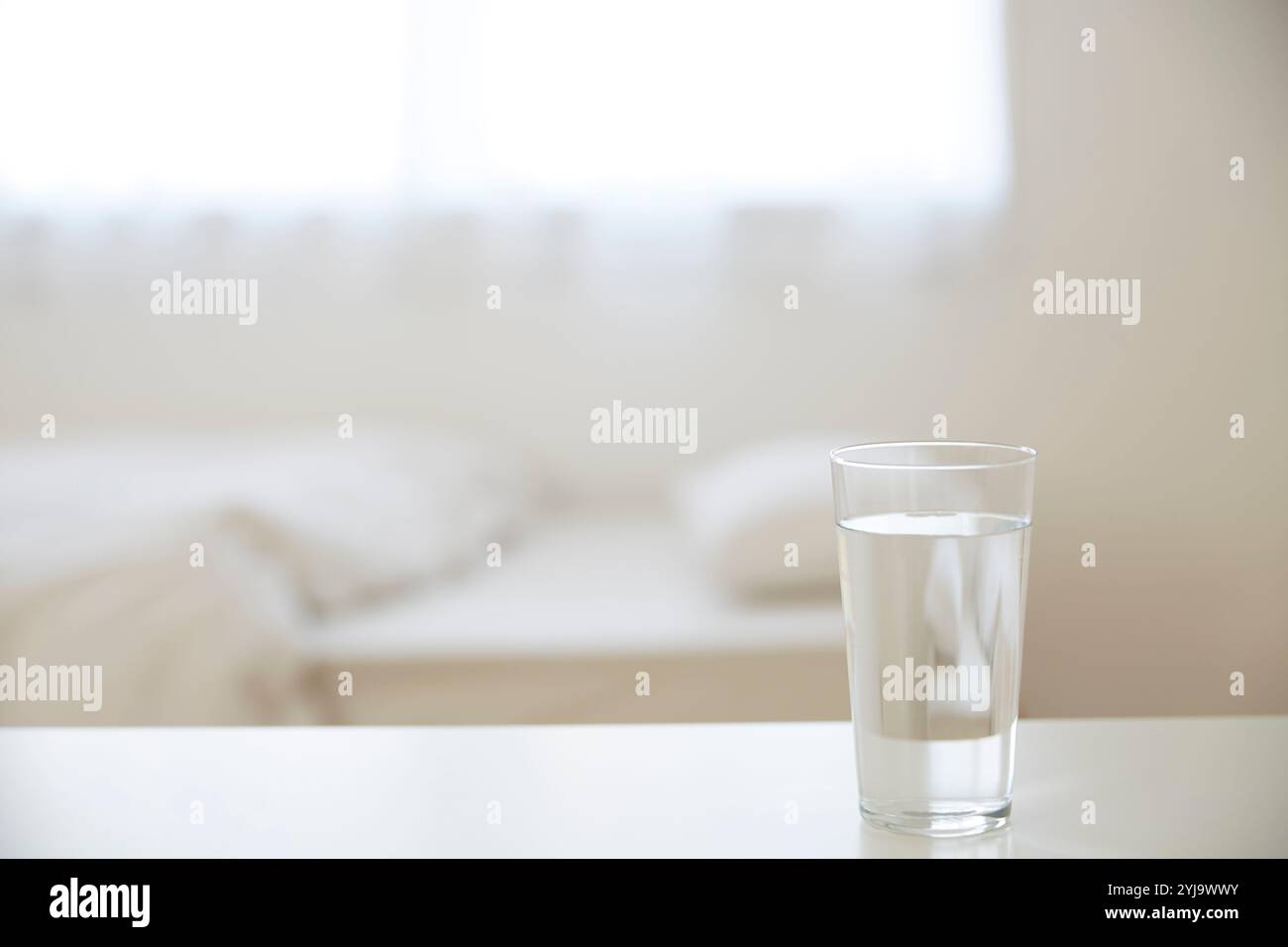 Glass of water on bed side table hi-res stock photography and images ...