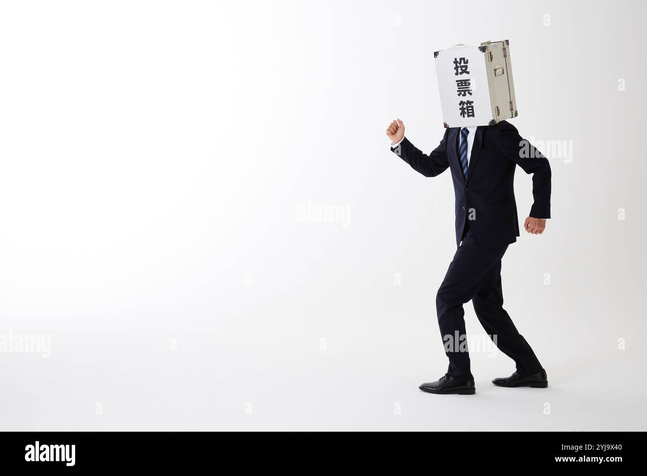 Ballot box man in walking pose Stock Photo - Alamy