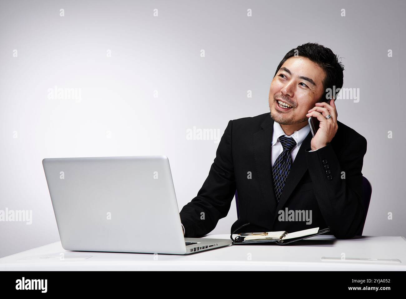 Man working at his desk at work Stock Photo - Alamy