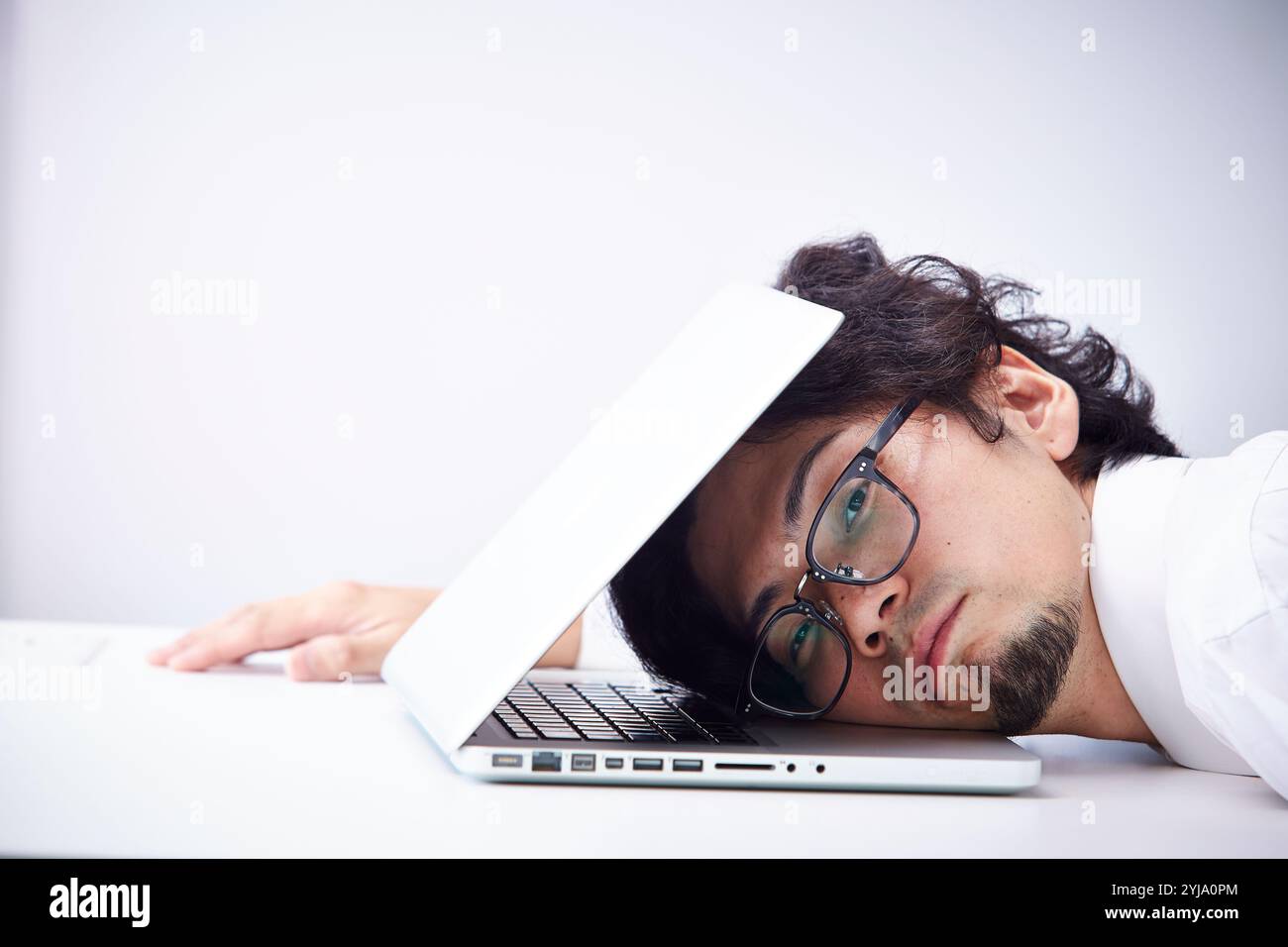 Man falling face down on laptop Stock Photo - Alamy