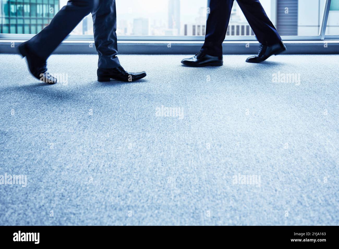 Footprints of two men intersecting Stock Photo - Alamy