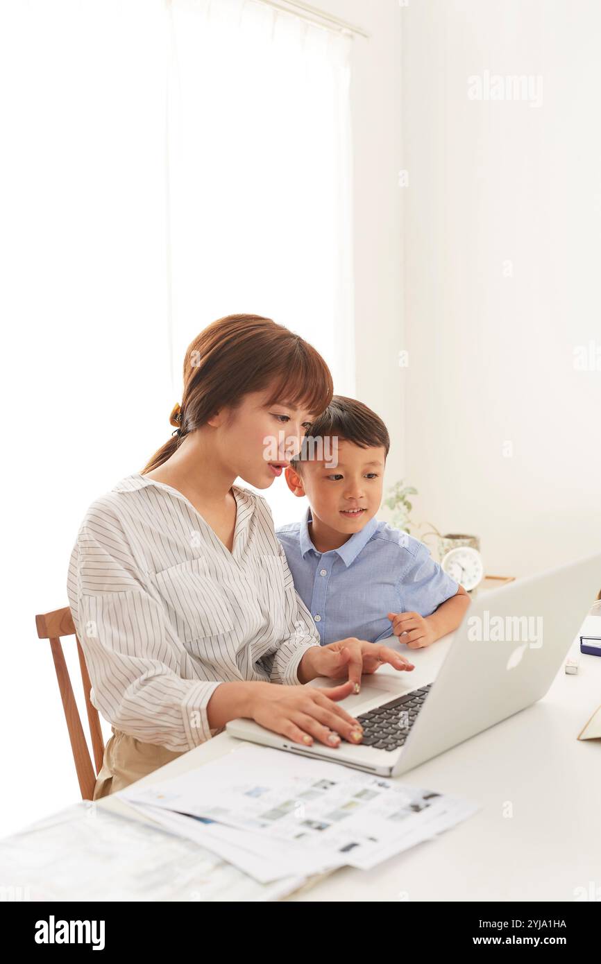 Boy working with computer hi-res stock photography and images - Alamy