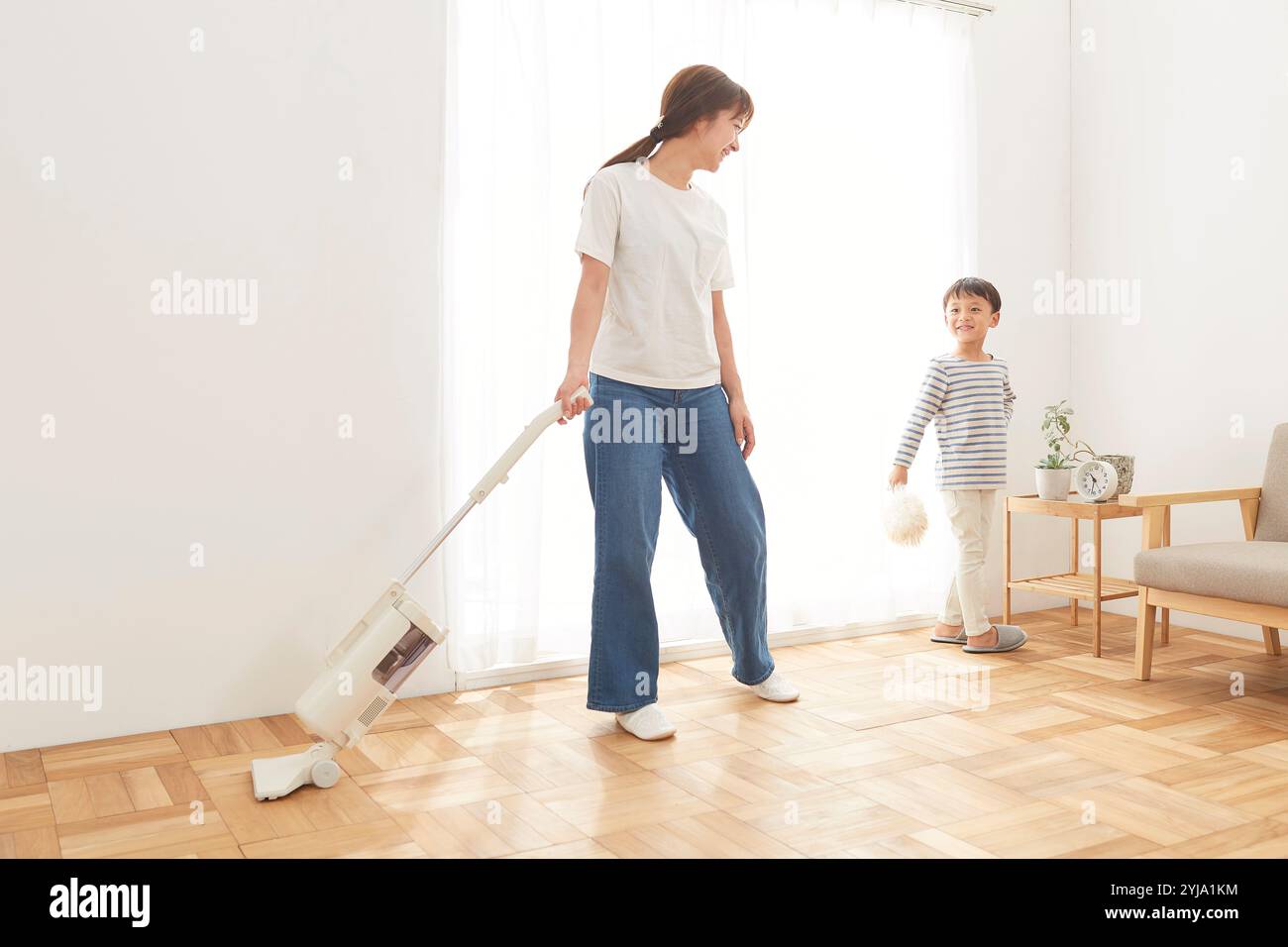 Parent and child cleaning the living room Stock Photo - Alamy