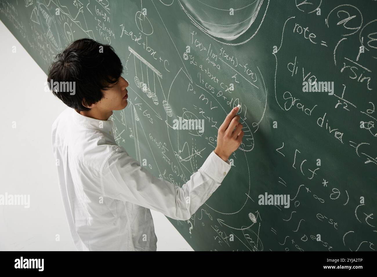 Chalkboards all over the wall filled with mathematical formulae Stock ...