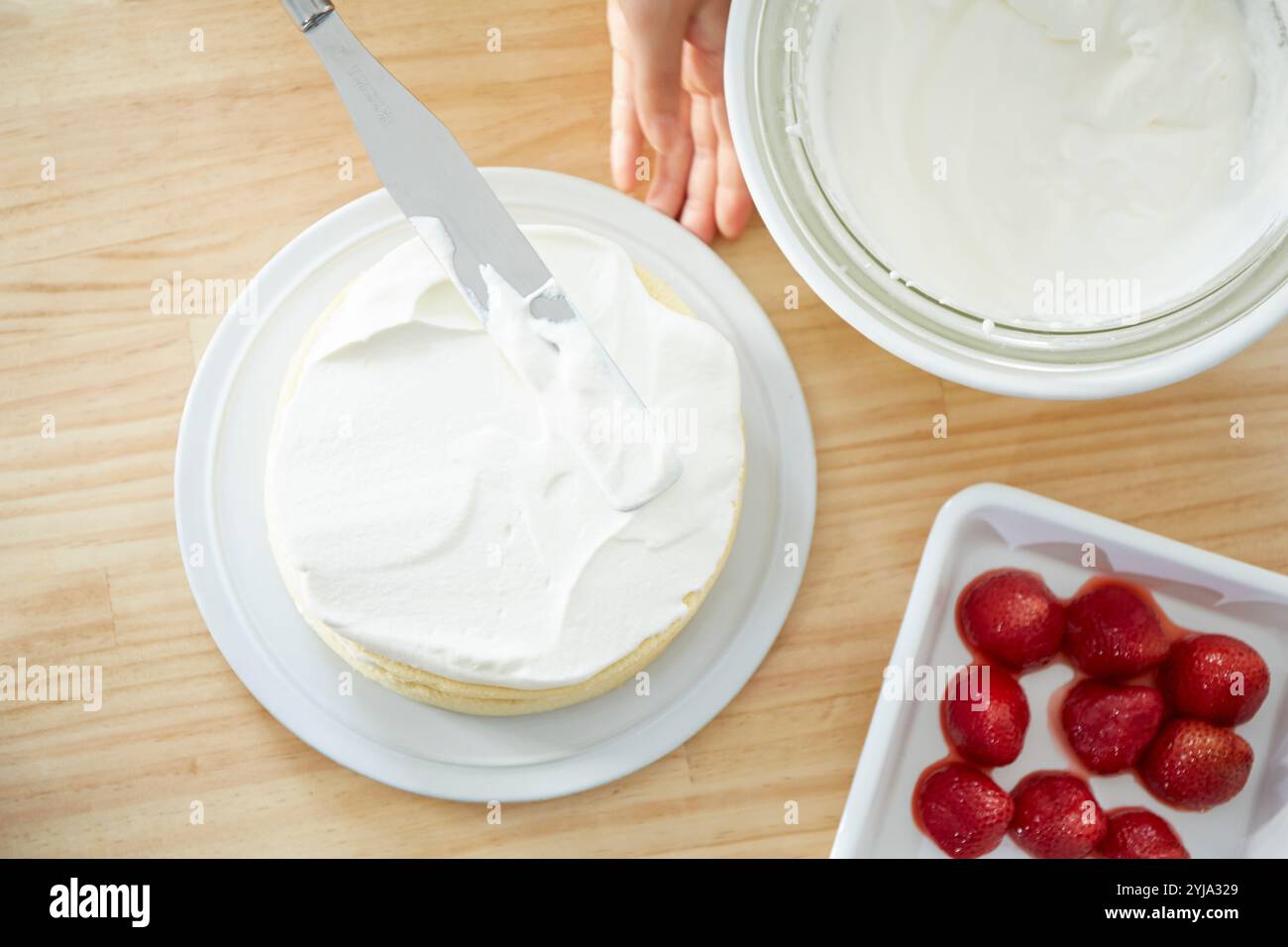 Overhead view of cream on cake Stock Photo - Alamy