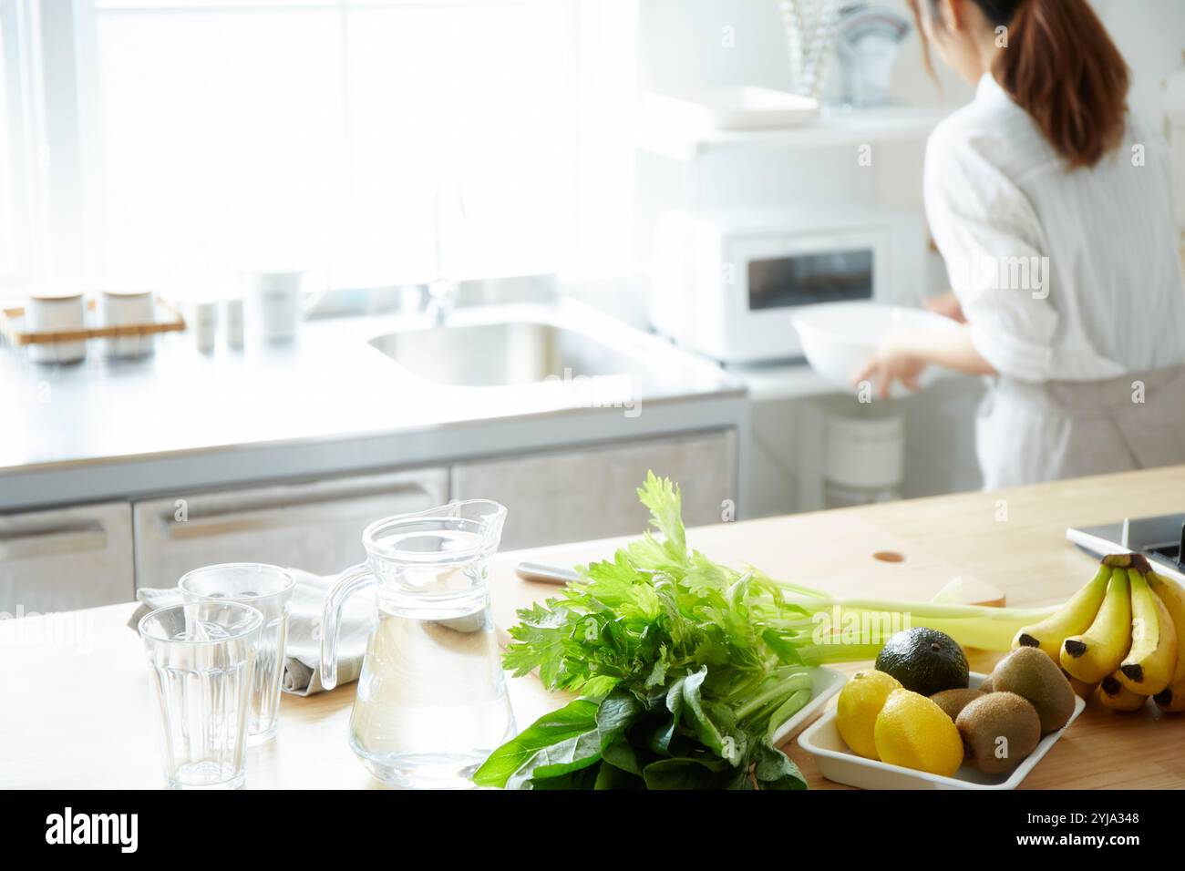Woman cooking in kitchen Stock Photo - Alamy