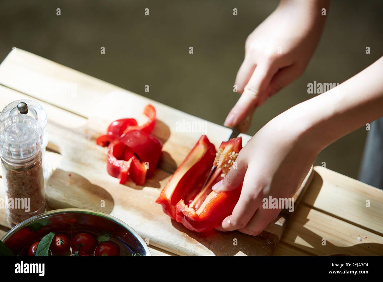 People chopping vegetables at a campsite Stock Photo - Alamy