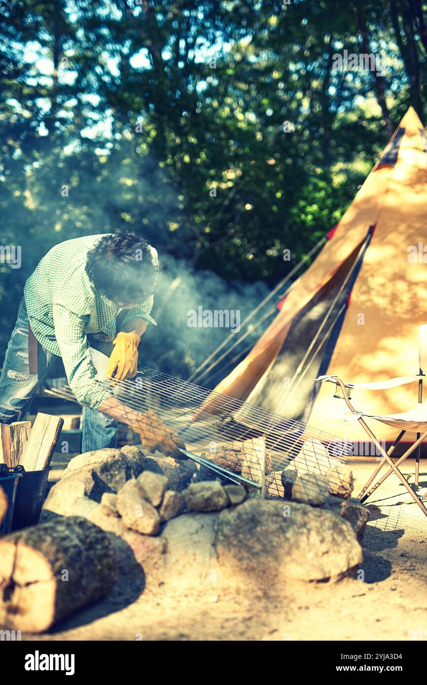 Man building fire hi-res stock photography and images - Alamy